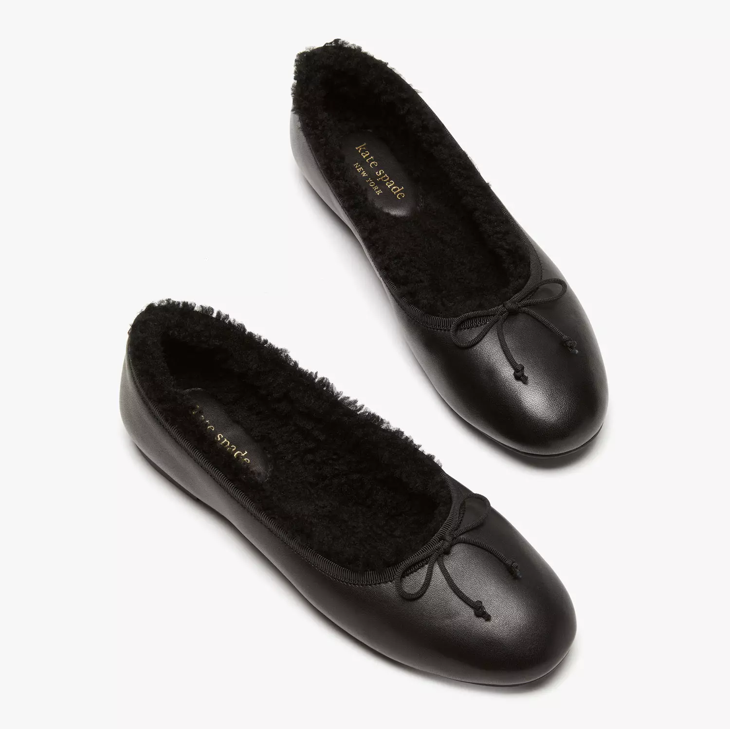 I-Kate Spade ye-honey shearling flats, emnyama