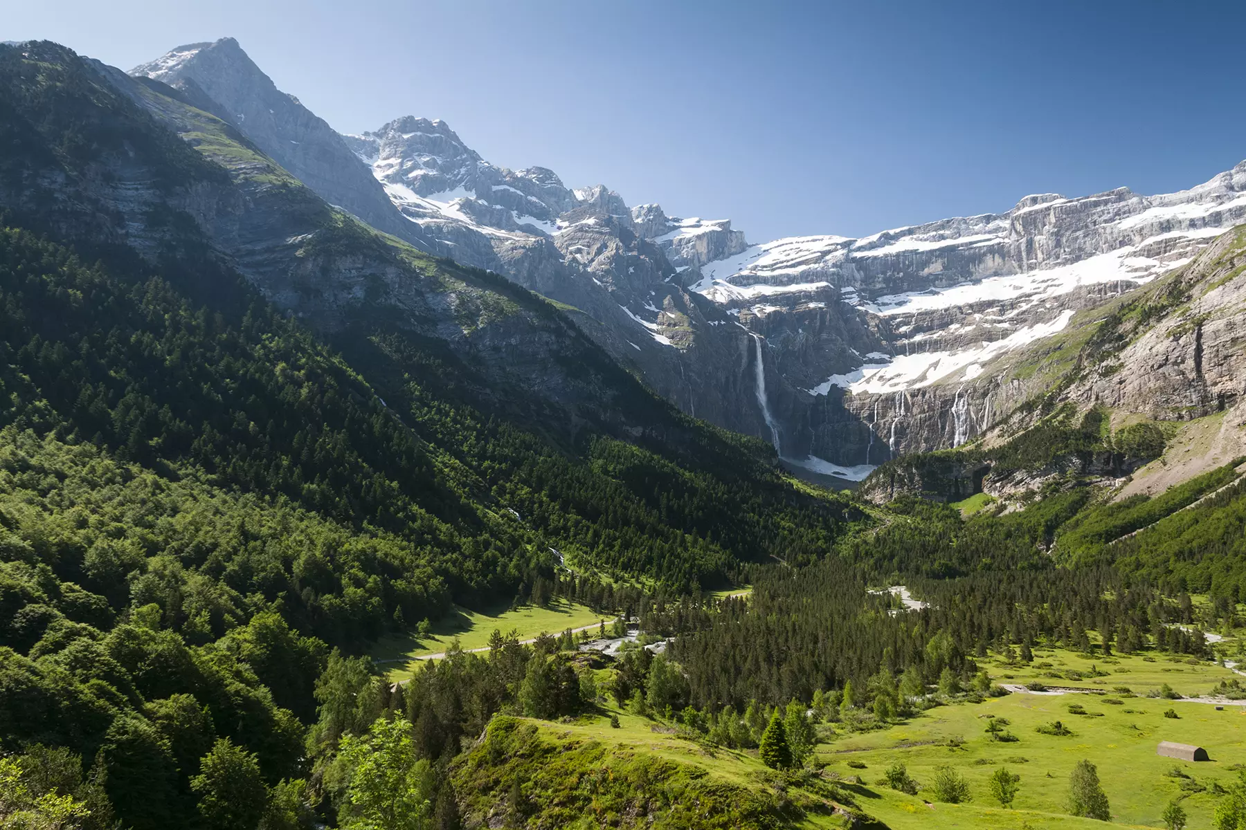 France, Pyrenees, Cirque de Gavarnie, cirque landscape w Gave de Gavarnie river.