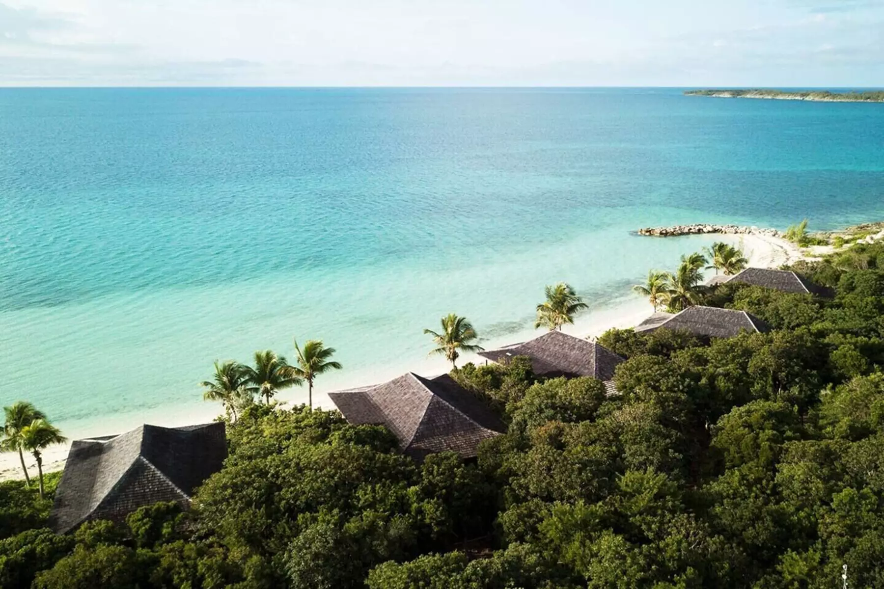 Aerial view beachfront bungalows Cuvée's Royal Island